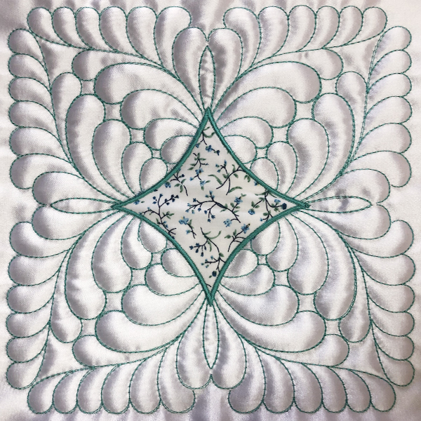 Trapunto Applique Feather Quilt | OregonPatchWorks